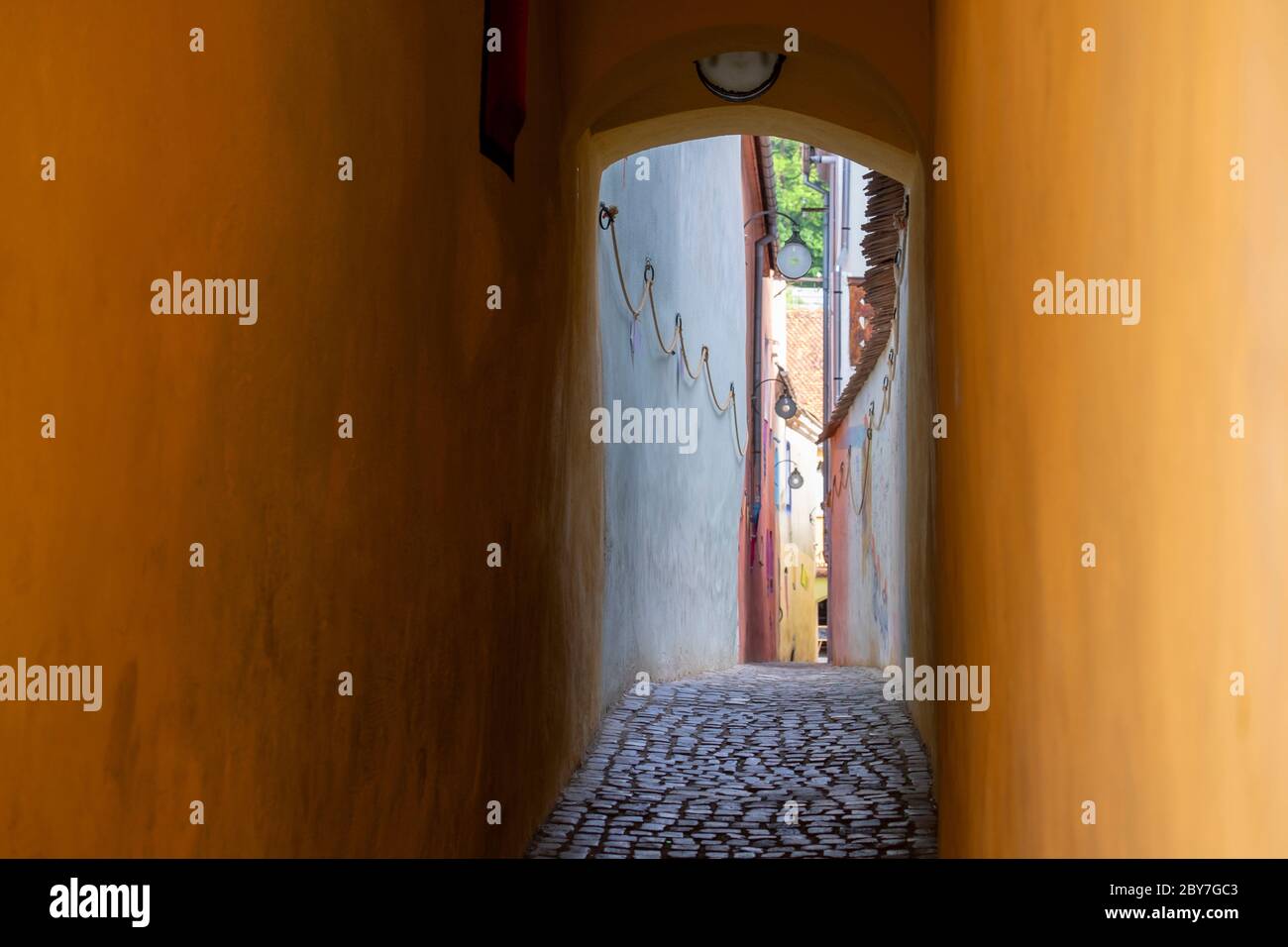 Rope street or Strada Sforii, the narrowest street in Brasov, in ...