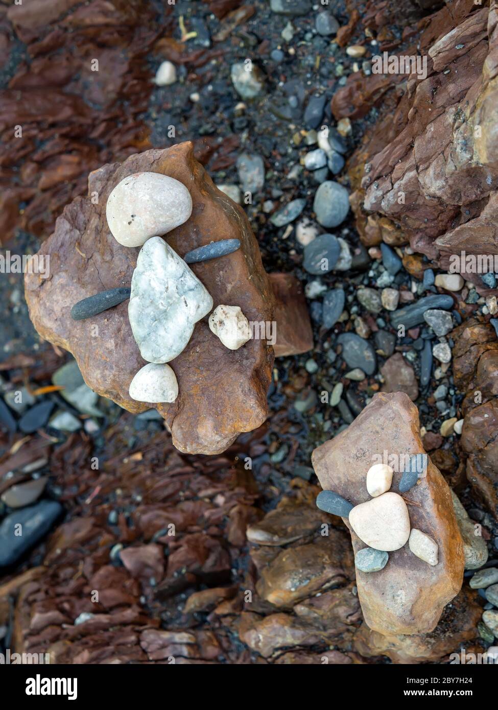 Two human stone figures Stock Photo - Alamy