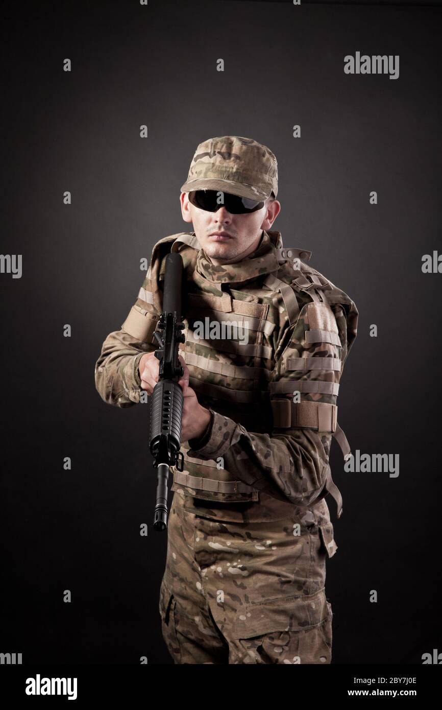 Modern soldier with rifle Stock Photo - Alamy