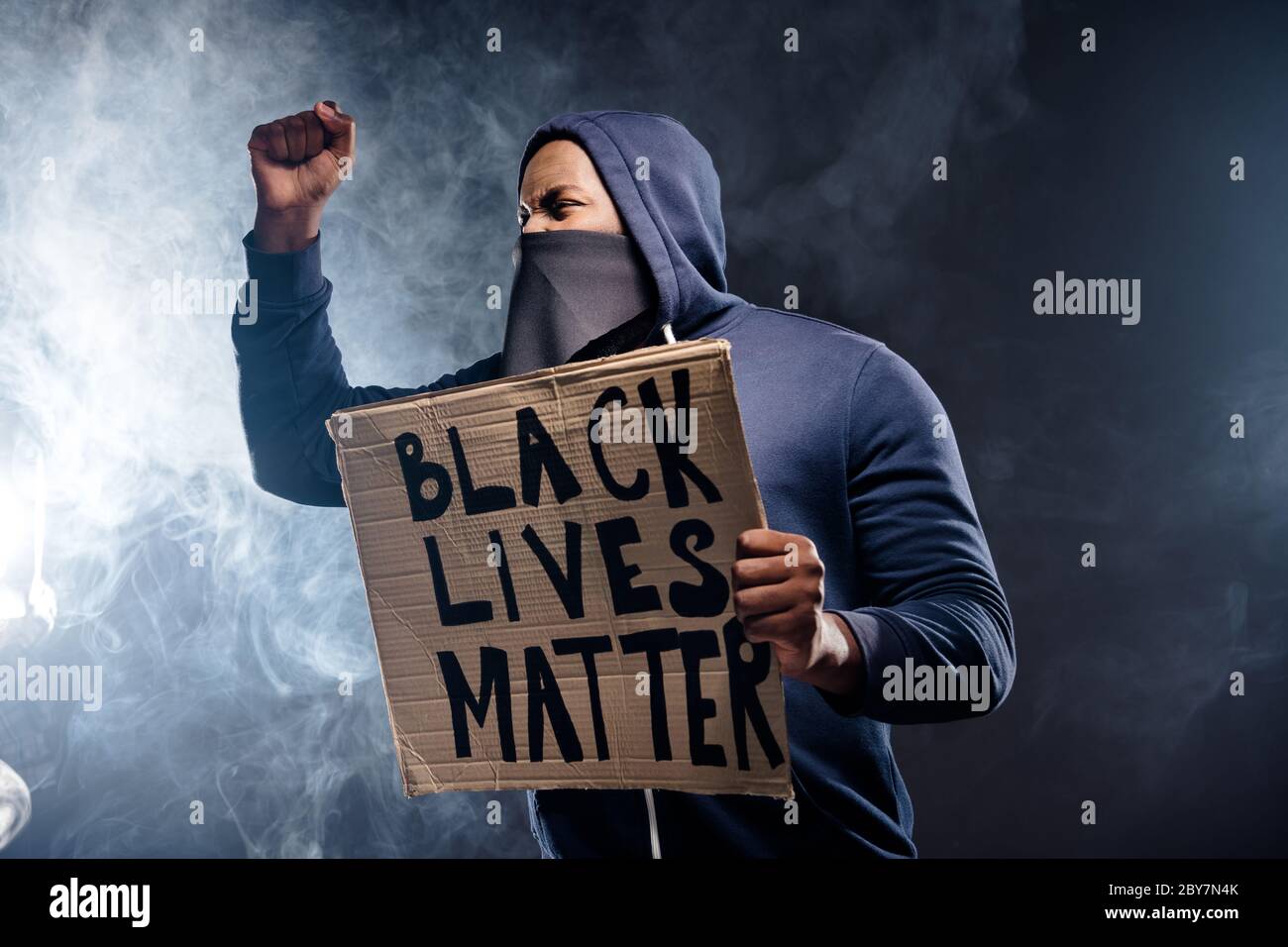 Profile side photo of crazy afro american guy hold banner raise fists ...