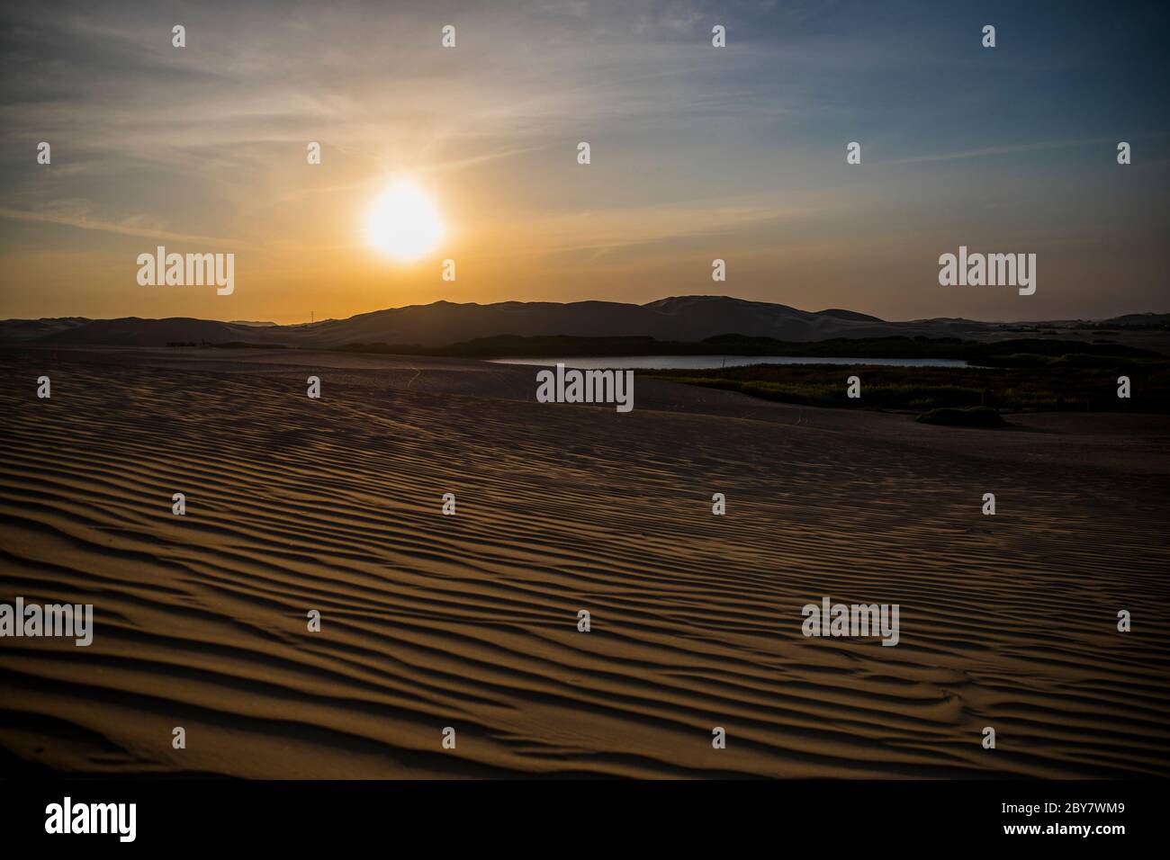 sunset in the desert with blue sky Stock Photo - Alamy