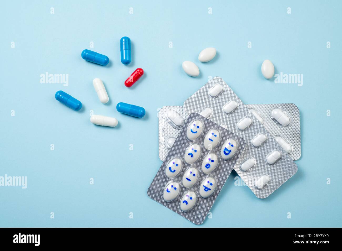 Pharmaceutical medicine background. Blister of funny pills with smiles ...