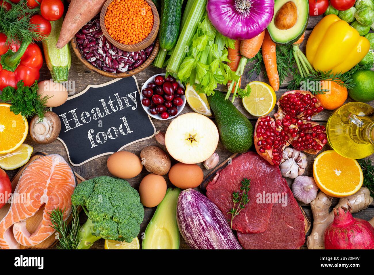 Background healthy food. Fresh vegetables, fruits, meat and fish on ...