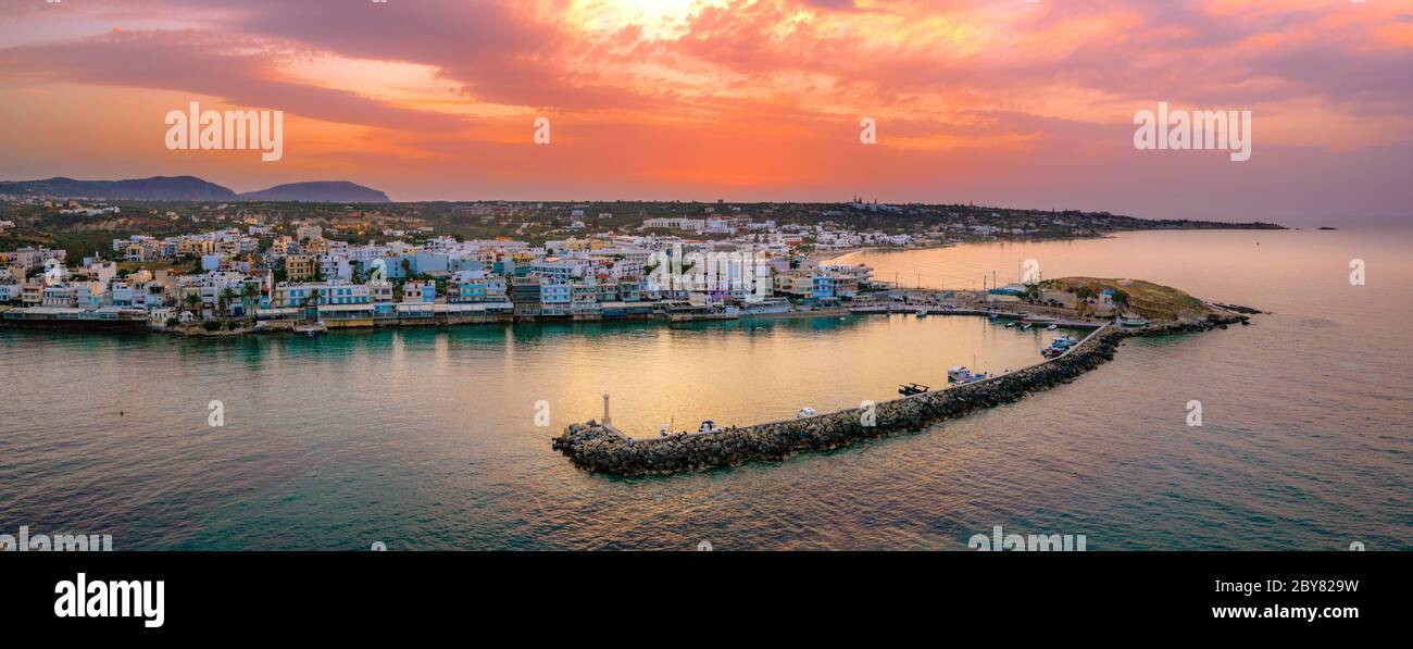 The harbor of the famous resort Chersonissos at sunset, Crete, Greece ...