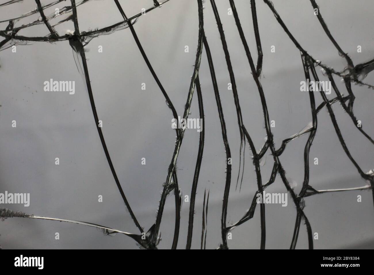 Cracks on a broken mirror Stock Photo - Alamy