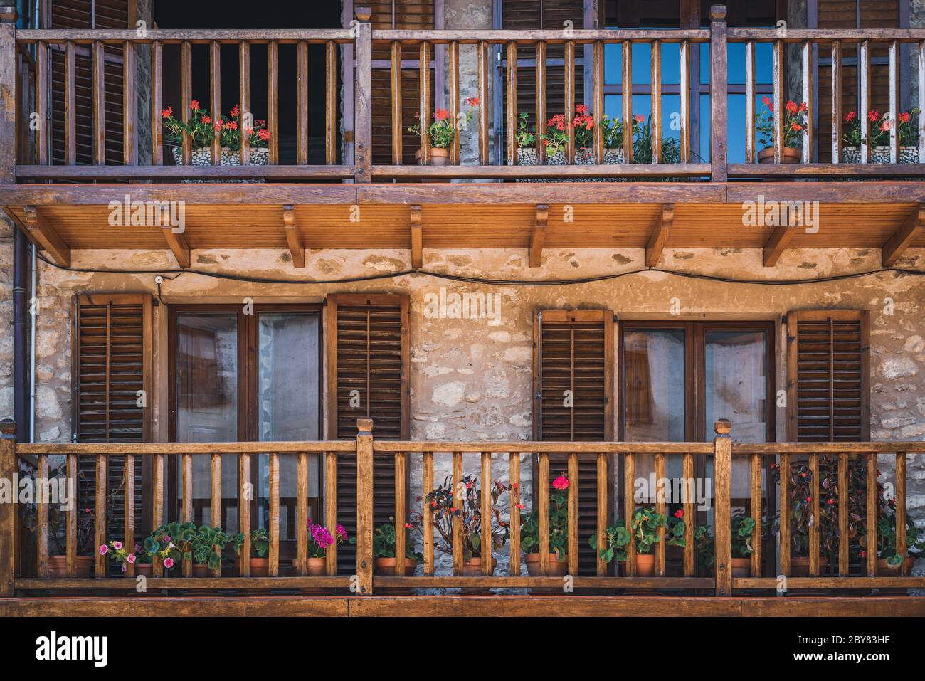 Wooden balconies of the facade of a traditional rural house Stock Photo ...