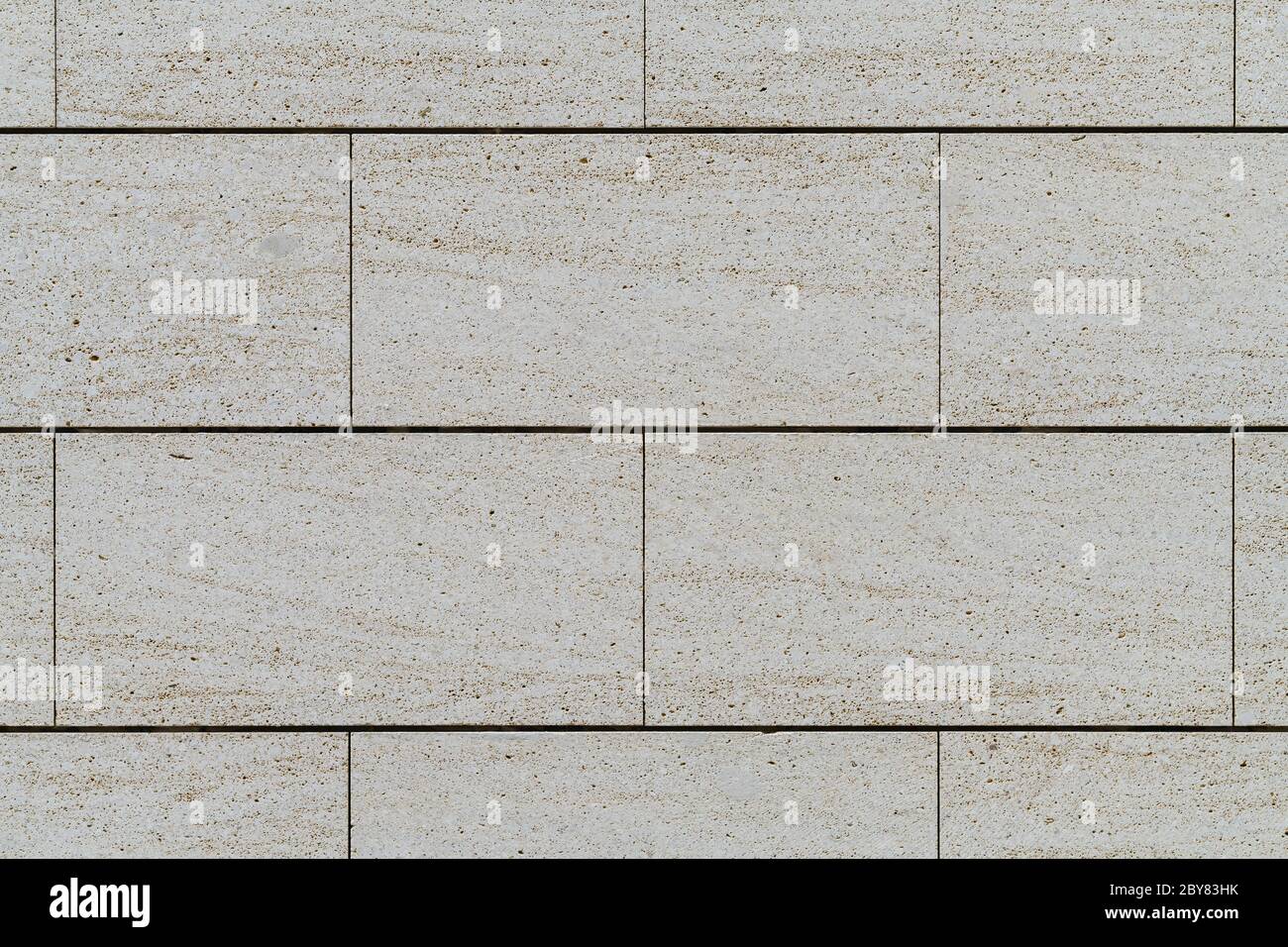 Wall built with big blocks of Travertine marble Stock Photo - Alamy