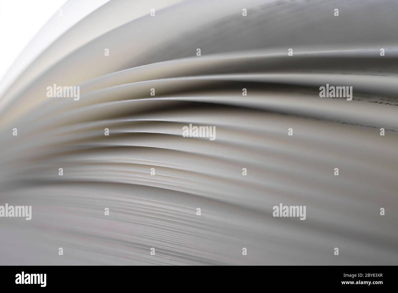 Stack of papers in a book with narrow depth of field Stock Photo - Alamy