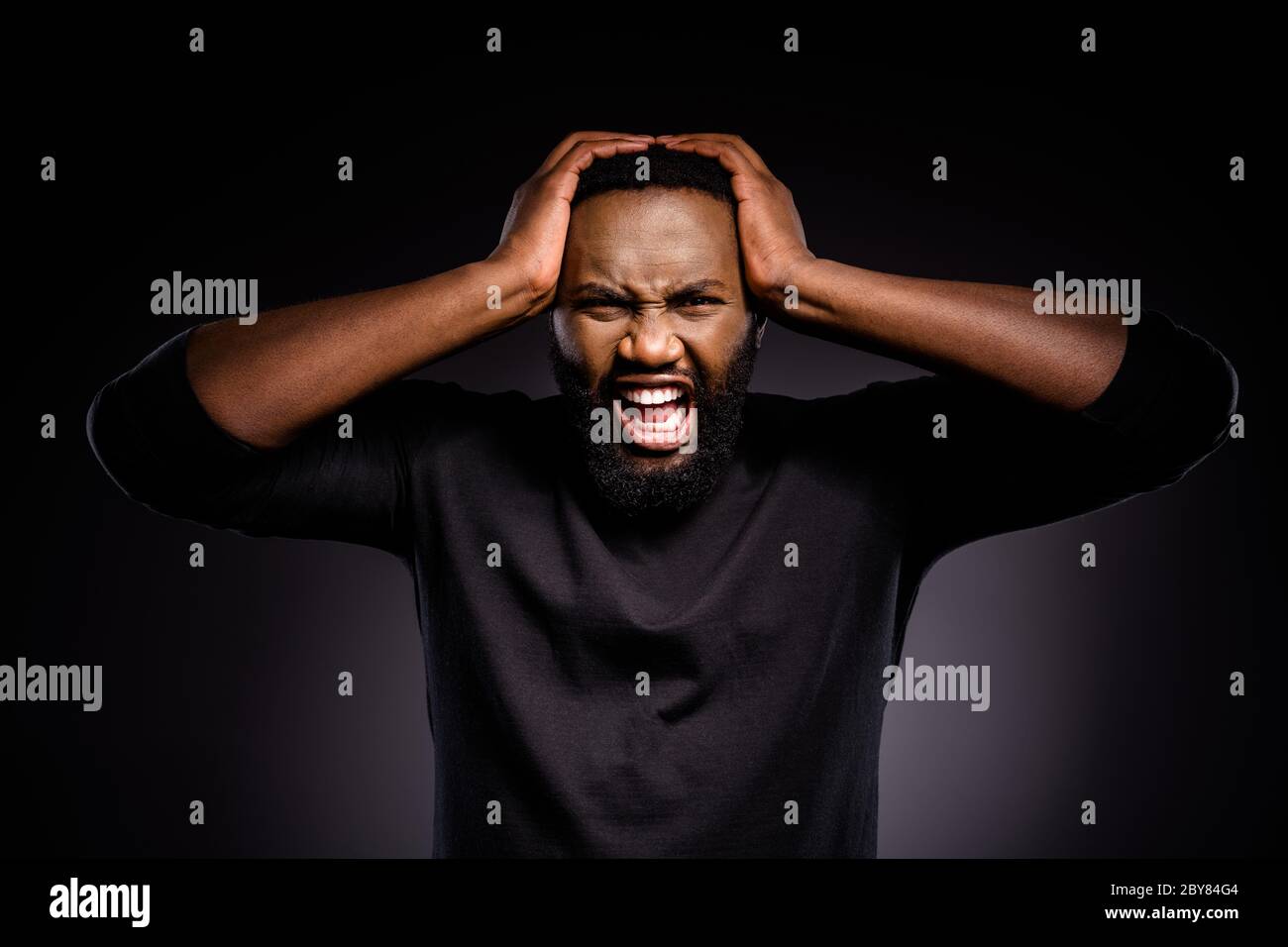 Photo of furious frustrated afro american guy touch hands head cant ...