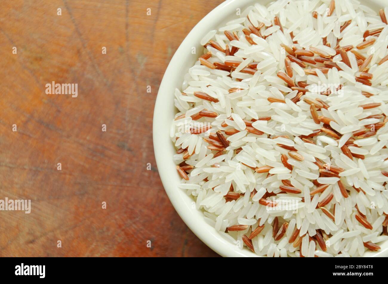mixed red cargo paddy on bowl in white background Stock Photo - Alamy