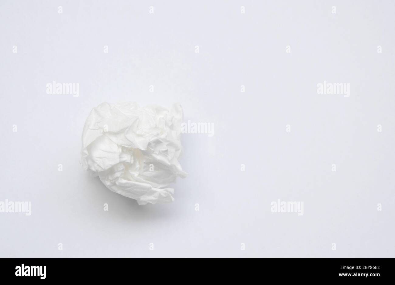 wet facial tissue paper crumbling on white background Stock Photo - Alamy