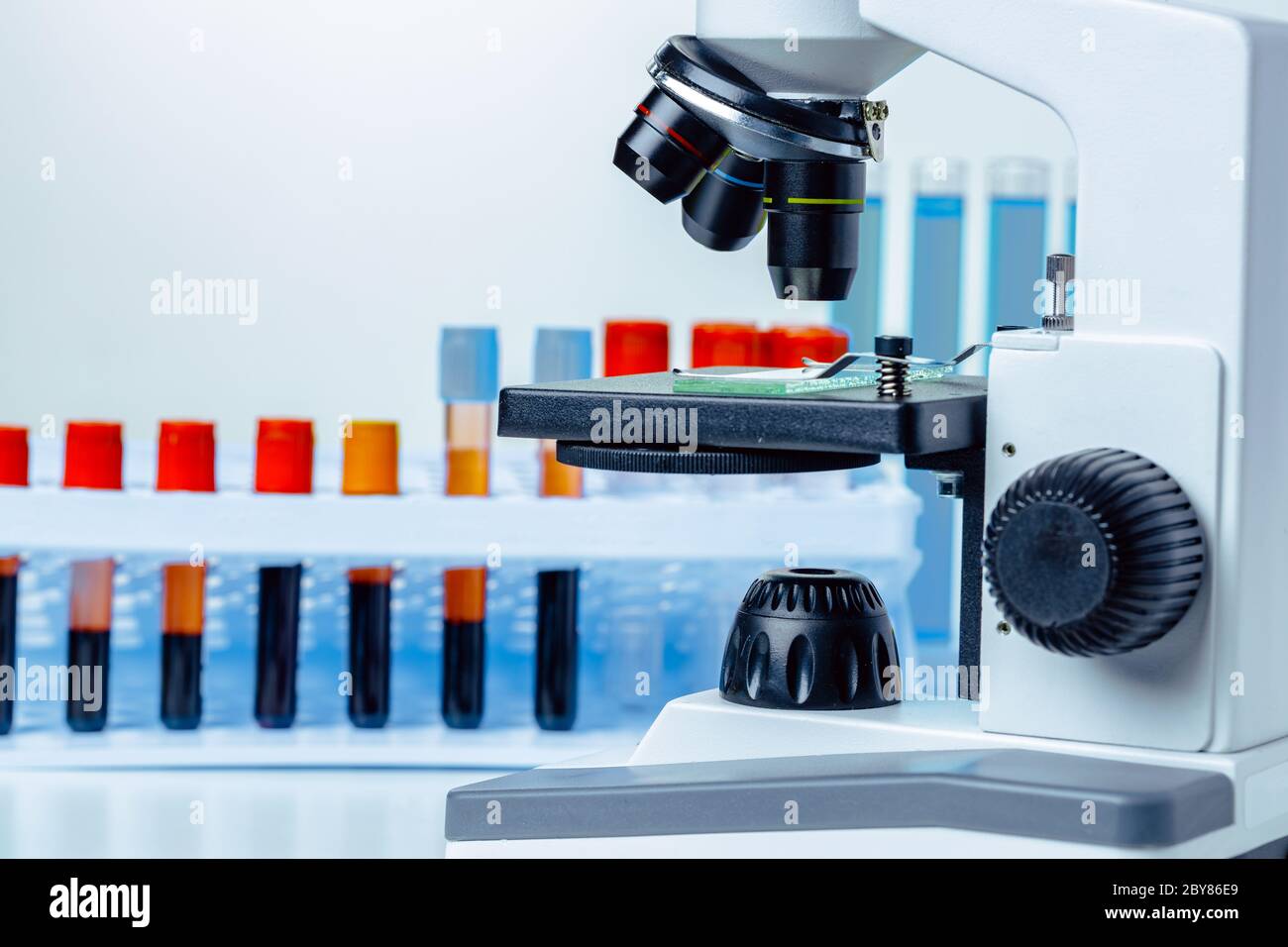 Microscope with test tubes for research close up Stock Photo - Alamy