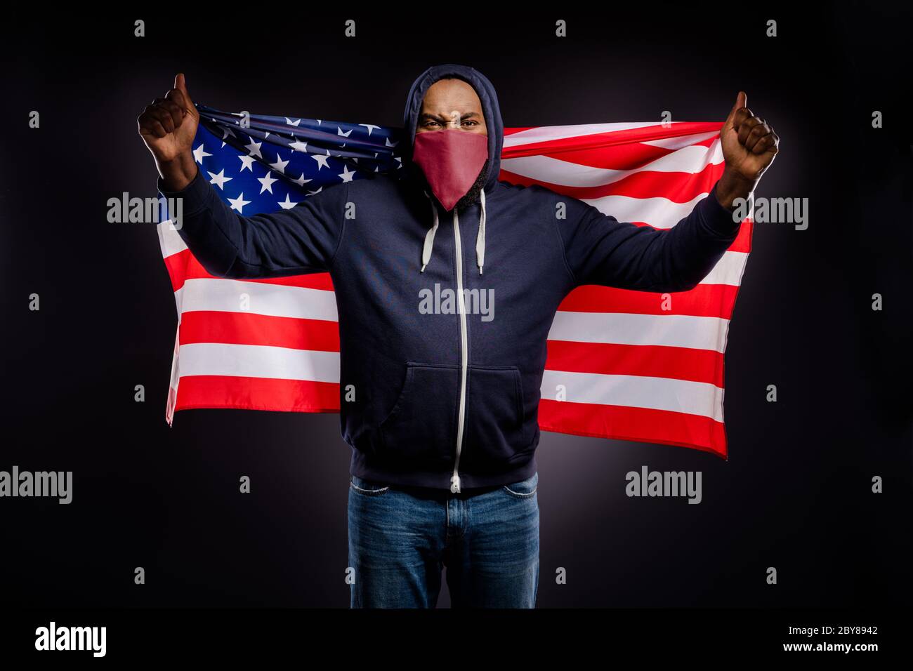 Photo of crazy furious angry rebellion revolt afro american guy hold us ...