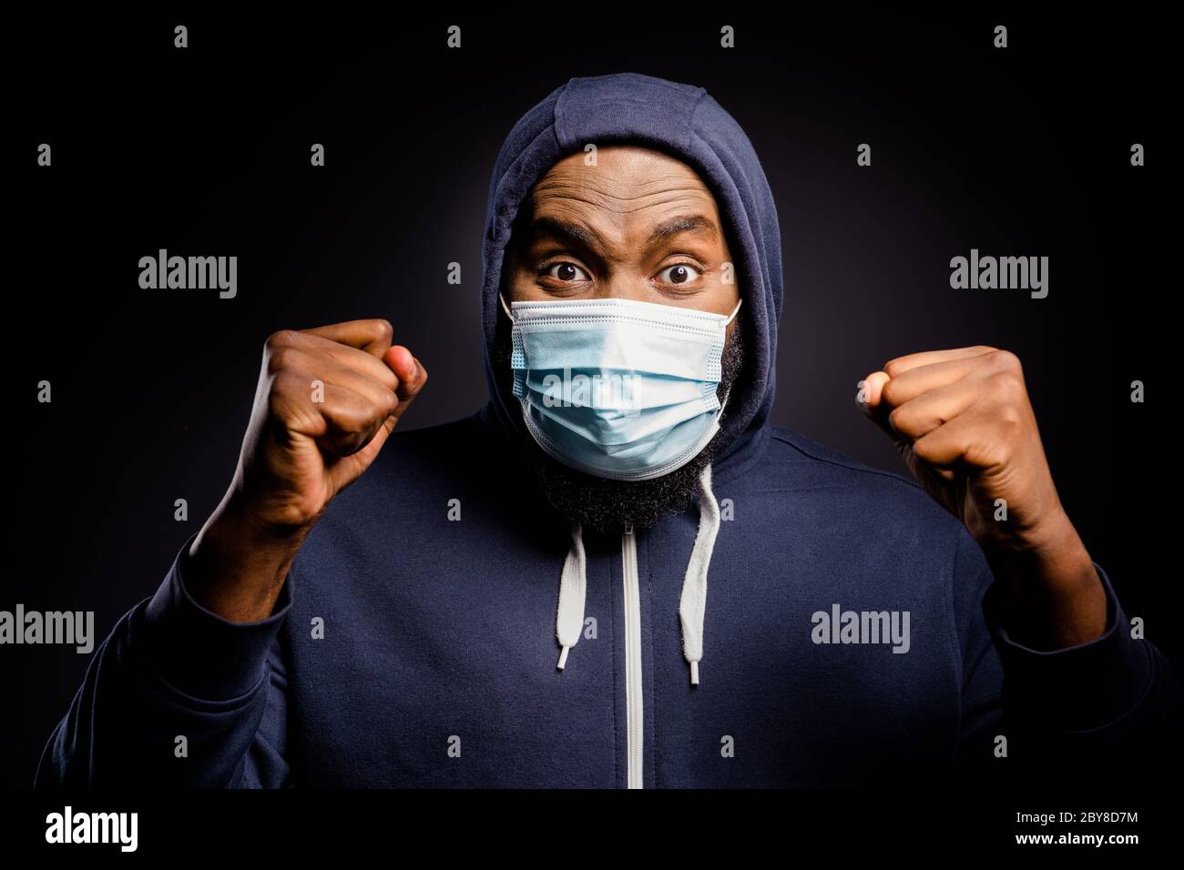 Yes we beat discrimination. Excited afro american guy raise fists enjoy ...