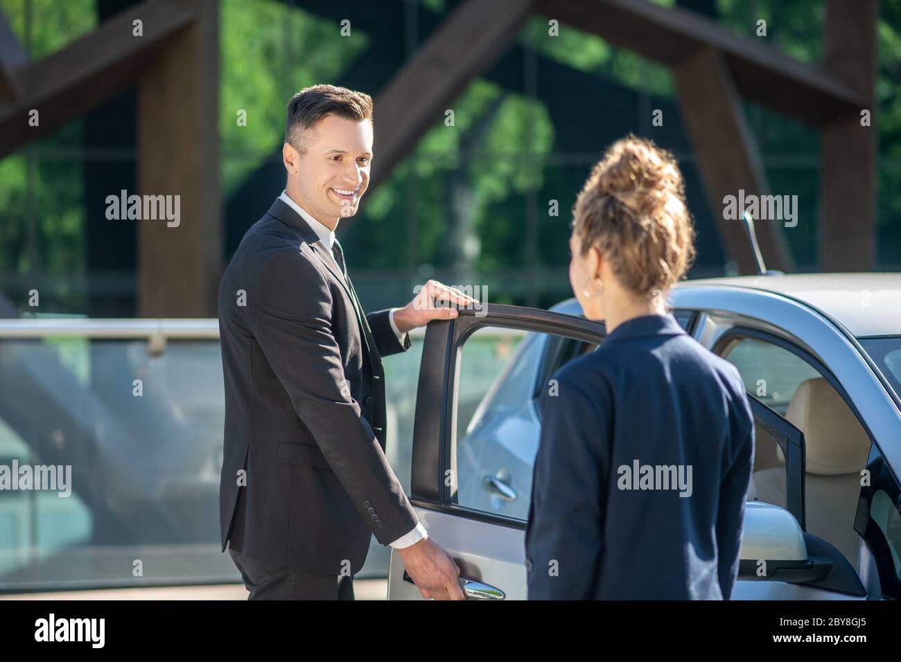 Driver opening car door hi-res stock photography and images - Alamy