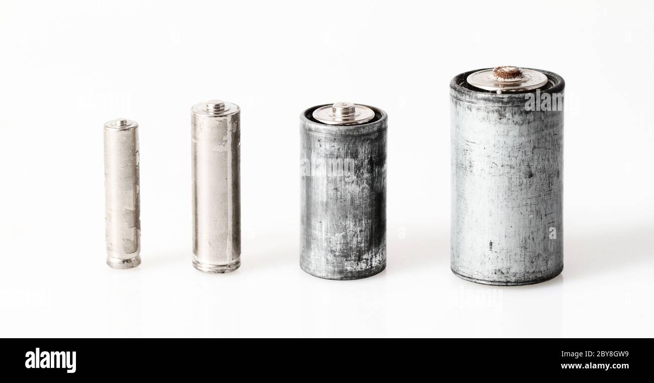 Old batteries isolated on white background Stock Photo - Alamy