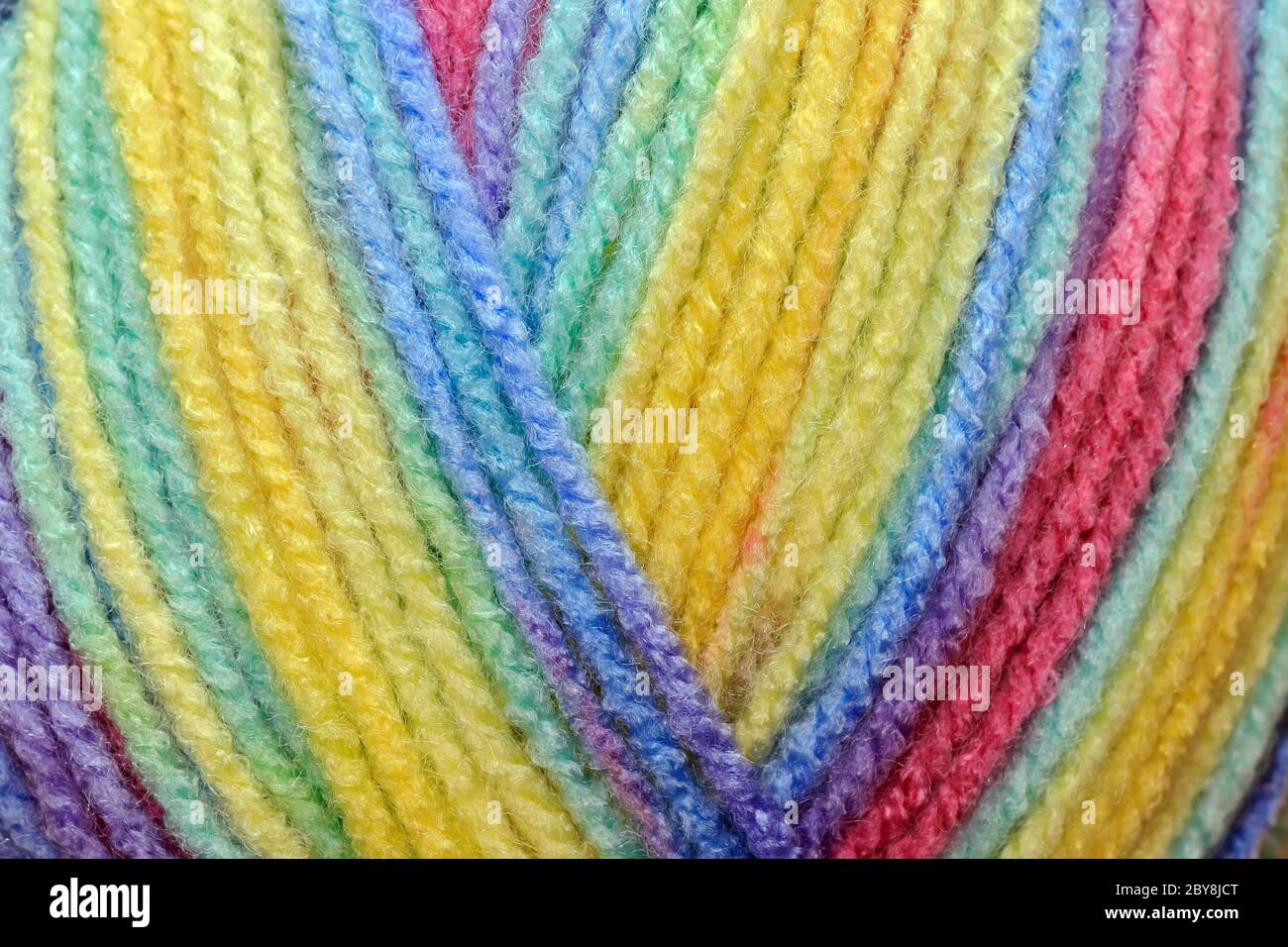 Close up on multi coloured ball of wool Stock Photo - Alamy