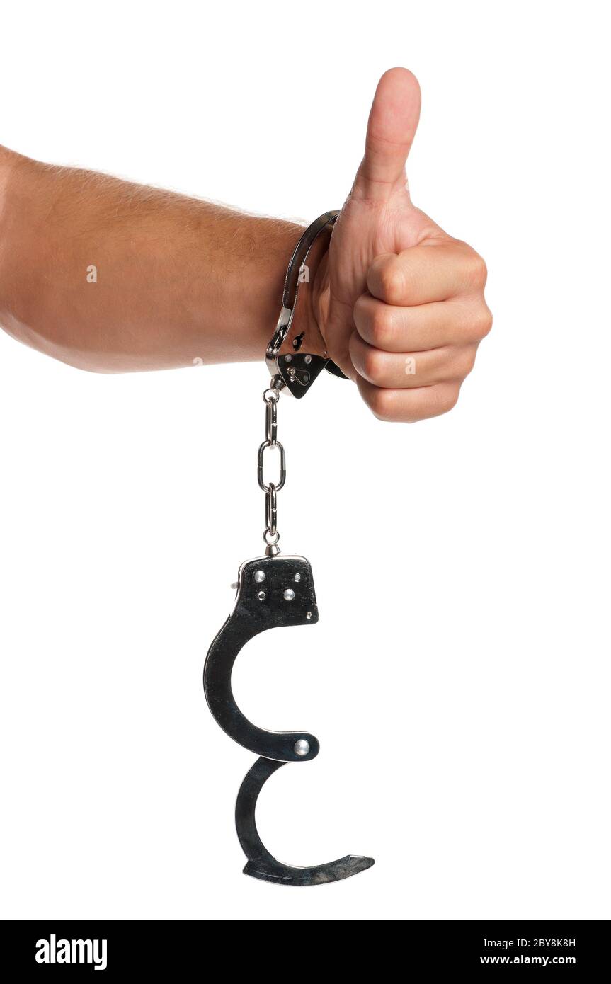 Hand with handcuffs Stock Photo - Alamy