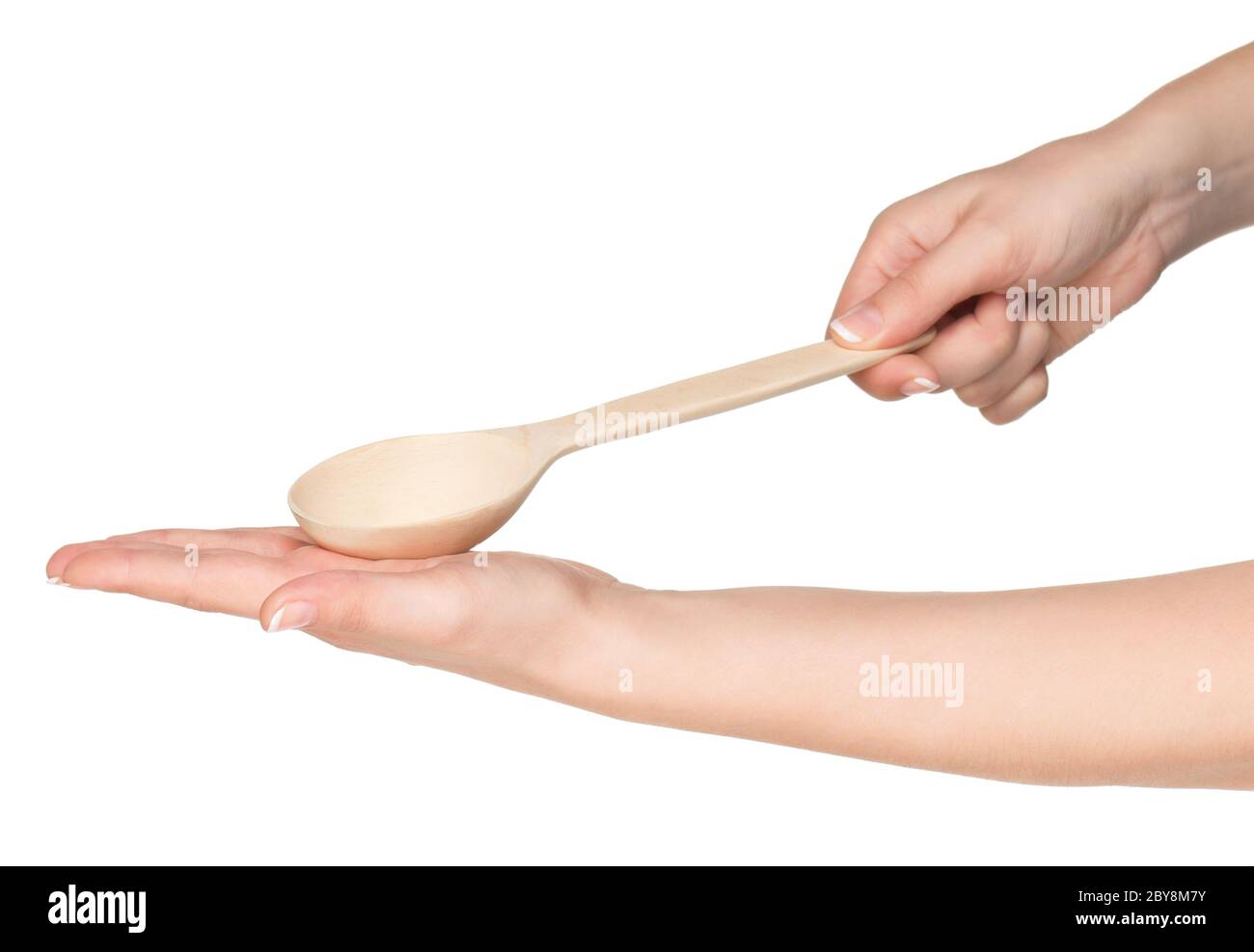 Hand with spoon Stock Photo - Alamy