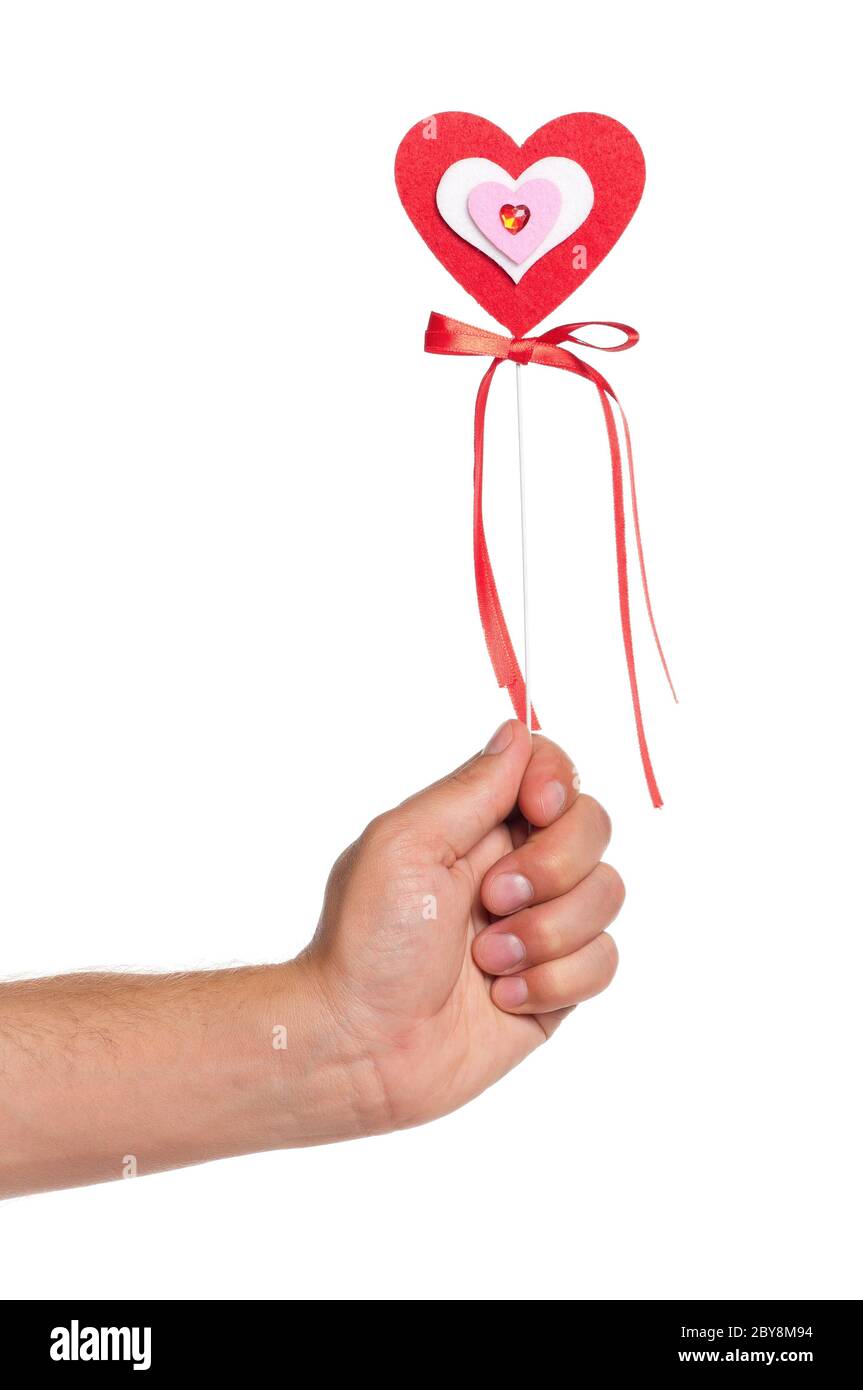 Hand with heart on a stick Stock Photo - Alamy