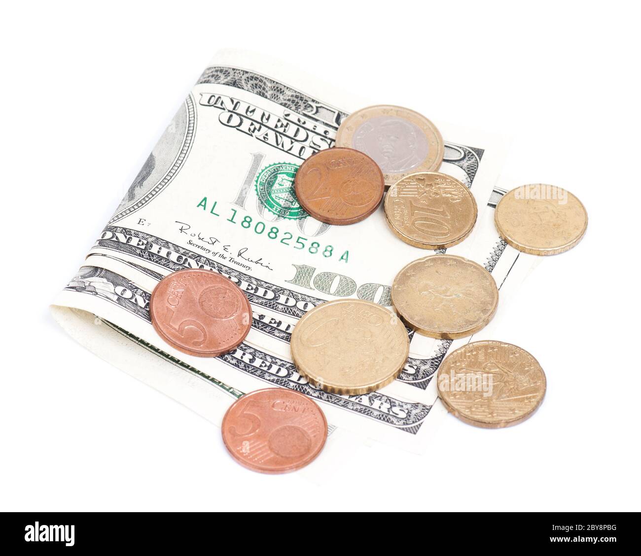 Coins over bills Stock Photo - Alamy