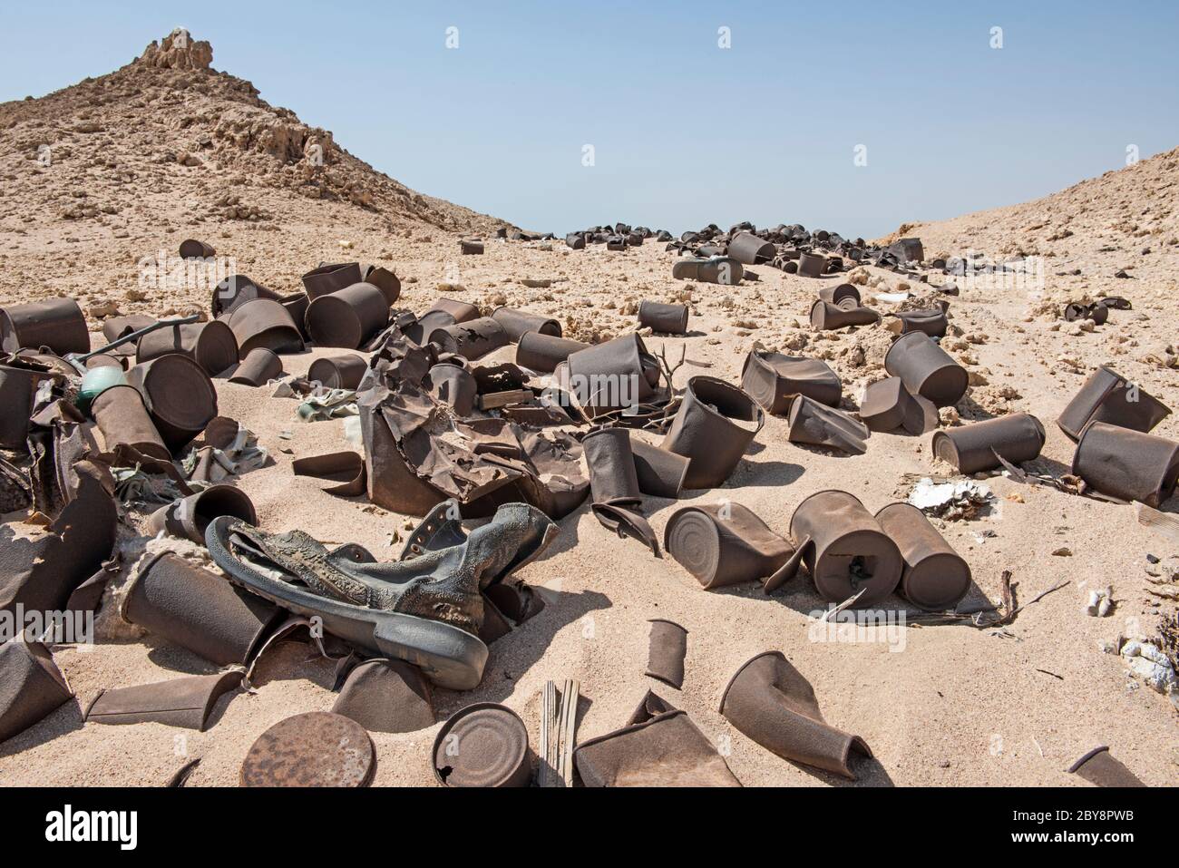 Closeup of tin cans rubbish pollution scattered and abandoned in remote ...