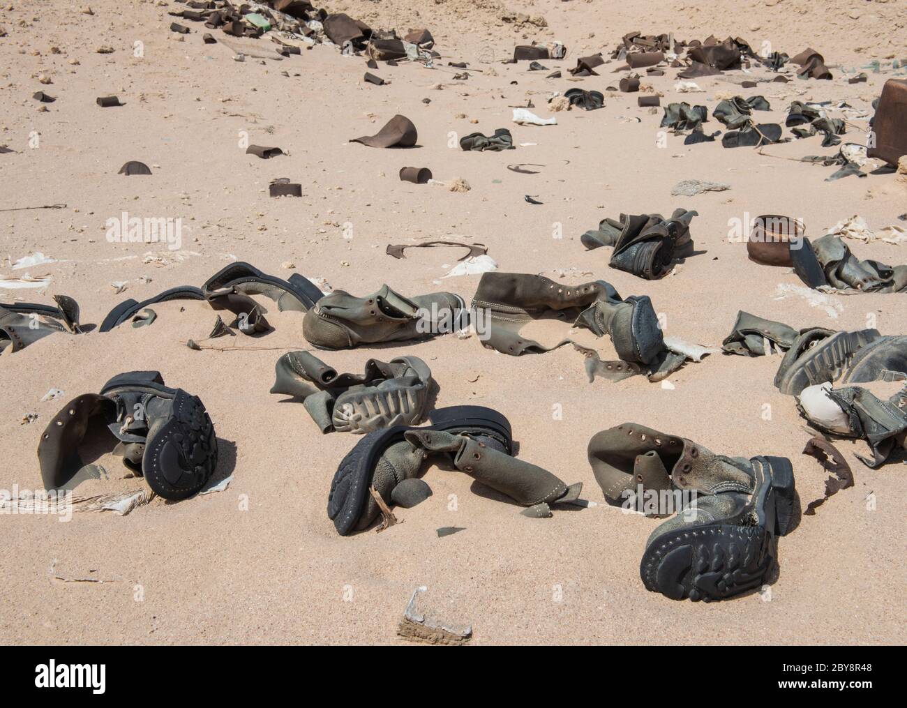 Closeup of old decaying military army boots abandoned in remote african ...