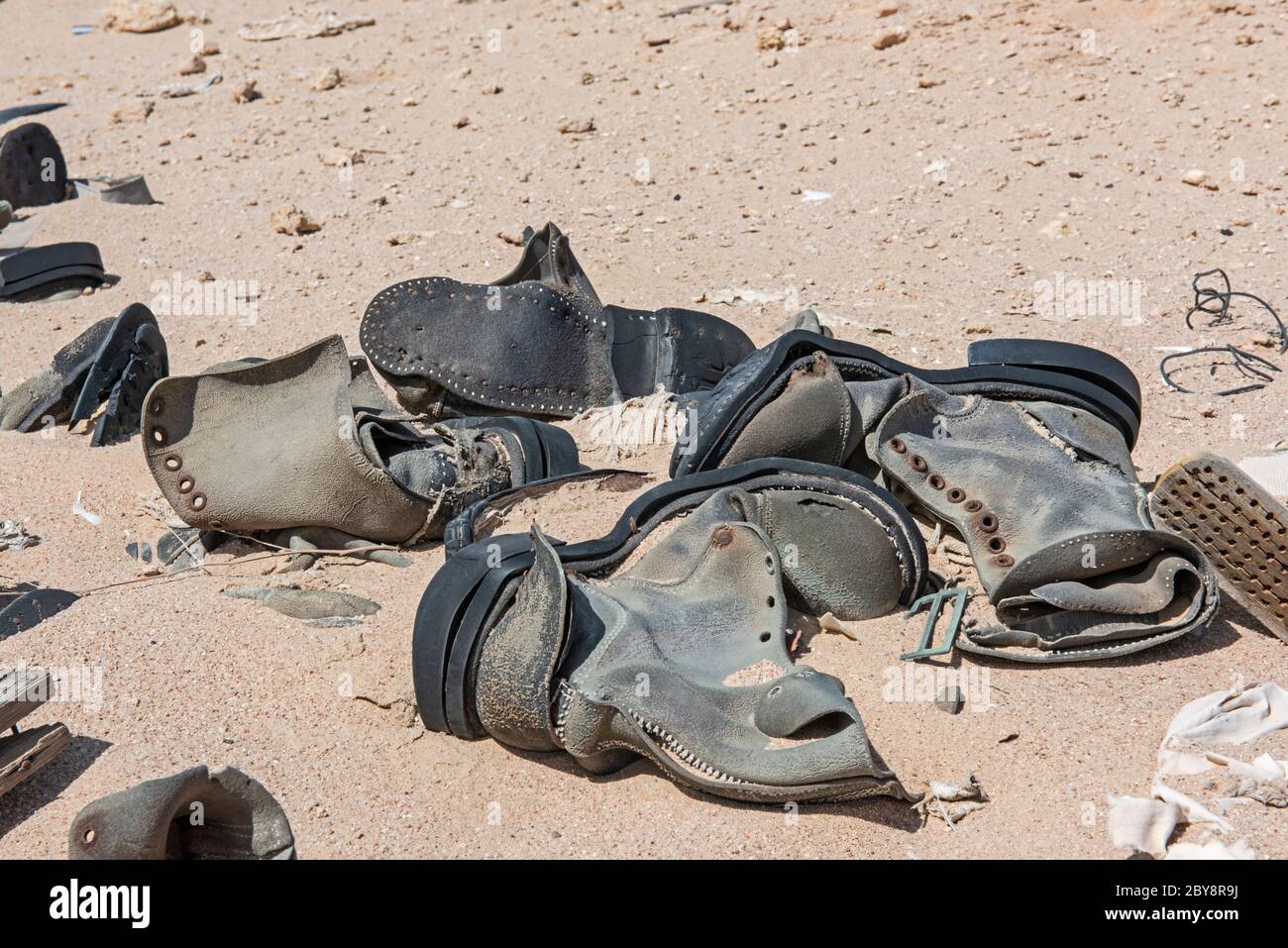 Closeup of old decaying military army boots abandoned in remote african ...