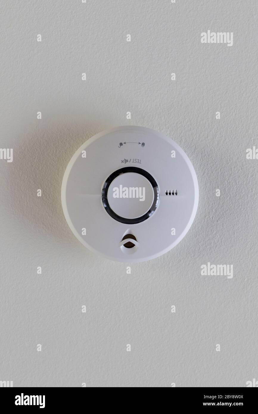 A close up portrait of a fire alarm sticking on a ceiling for safety ...