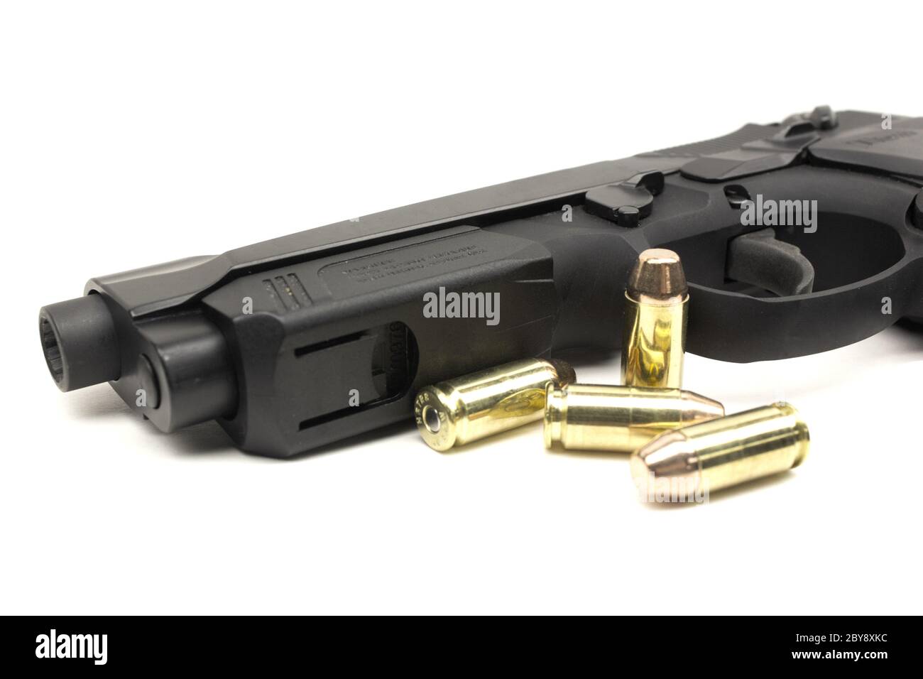 Handgun and bullets isolated on white Stock Photo - Alamy