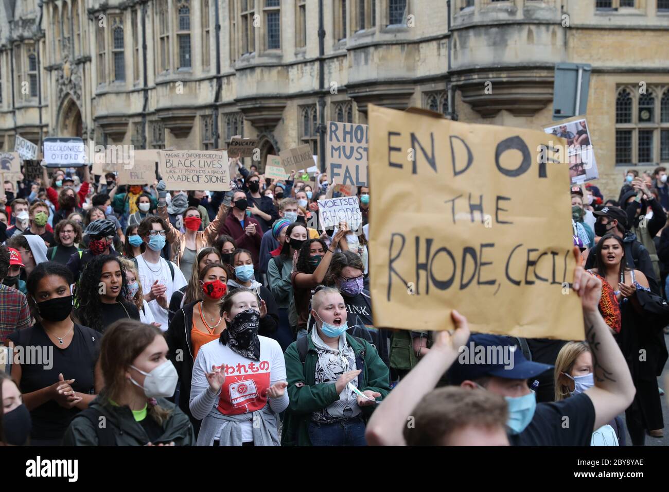 People during a protest calling for the removal of the statue of 19th ...