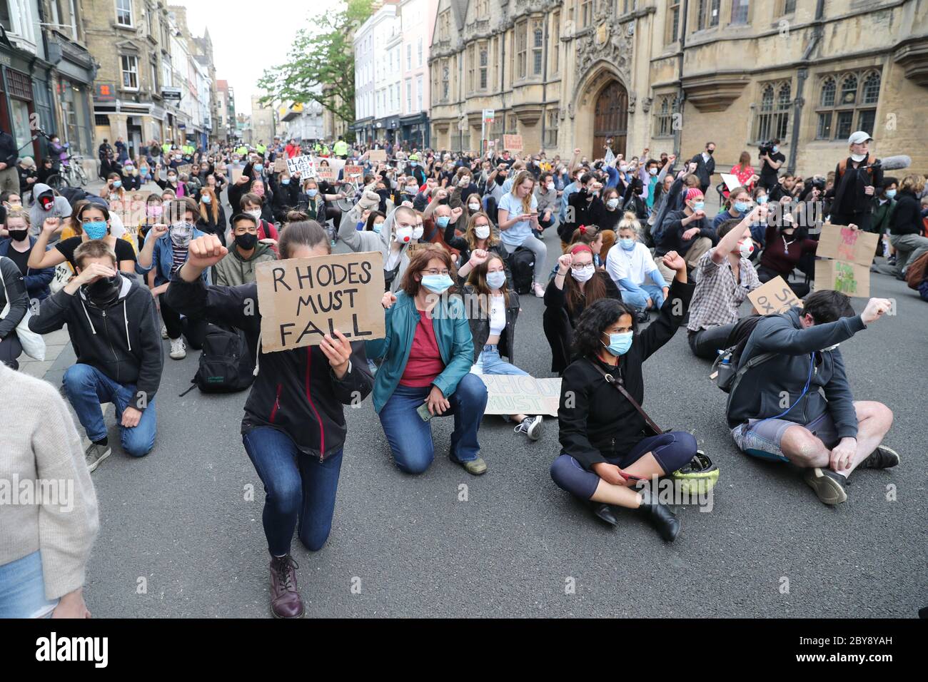 People during a protest calling for the removal of the statue of 19th ...