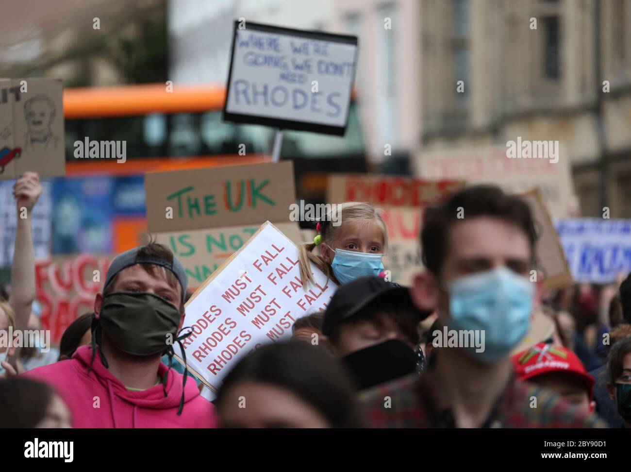 People during a protest calling for the removal of the statue of 19th ...