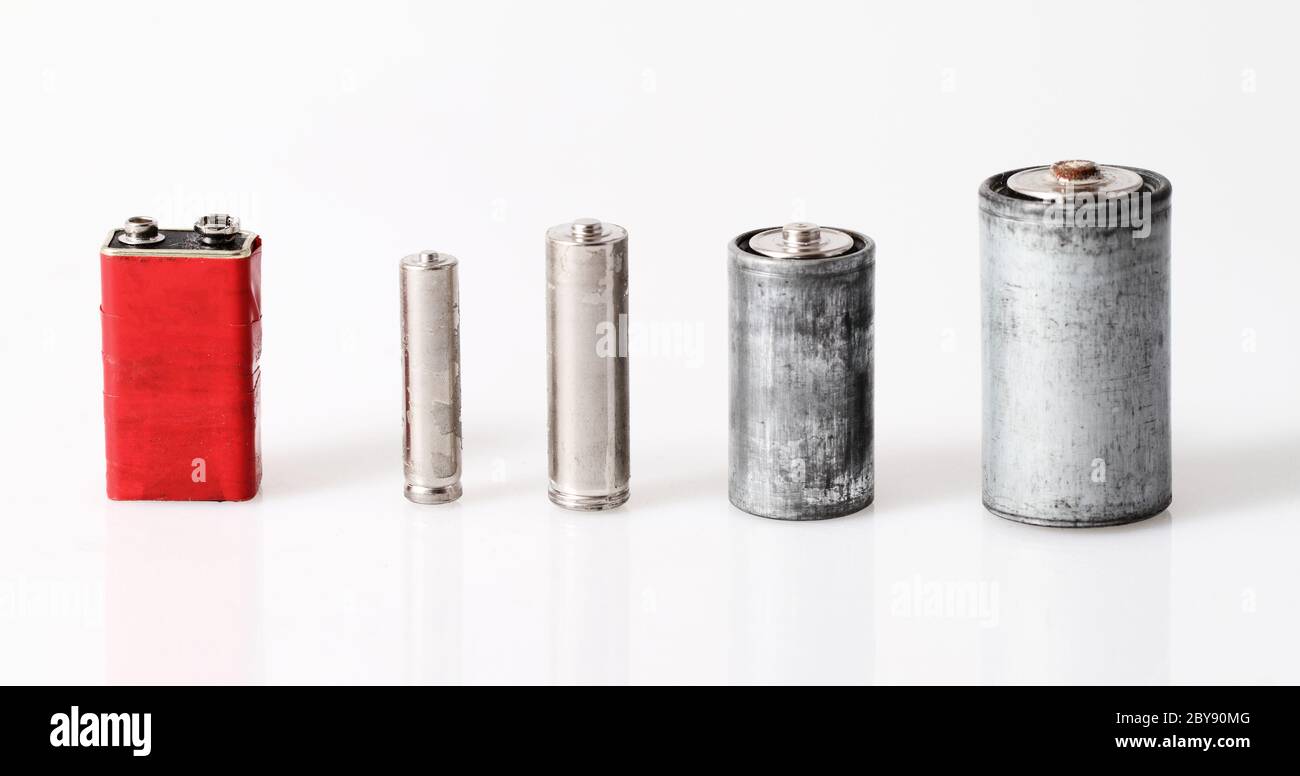Old batteries isolated on white background Stock Photo - Alamy