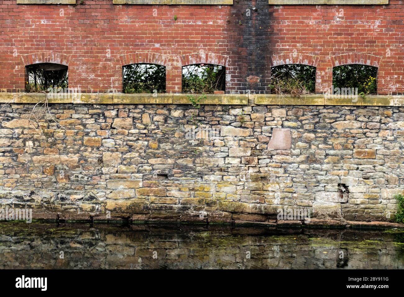 Remains of an old cotton mill on the bank of the Leeds to Liverpool ...