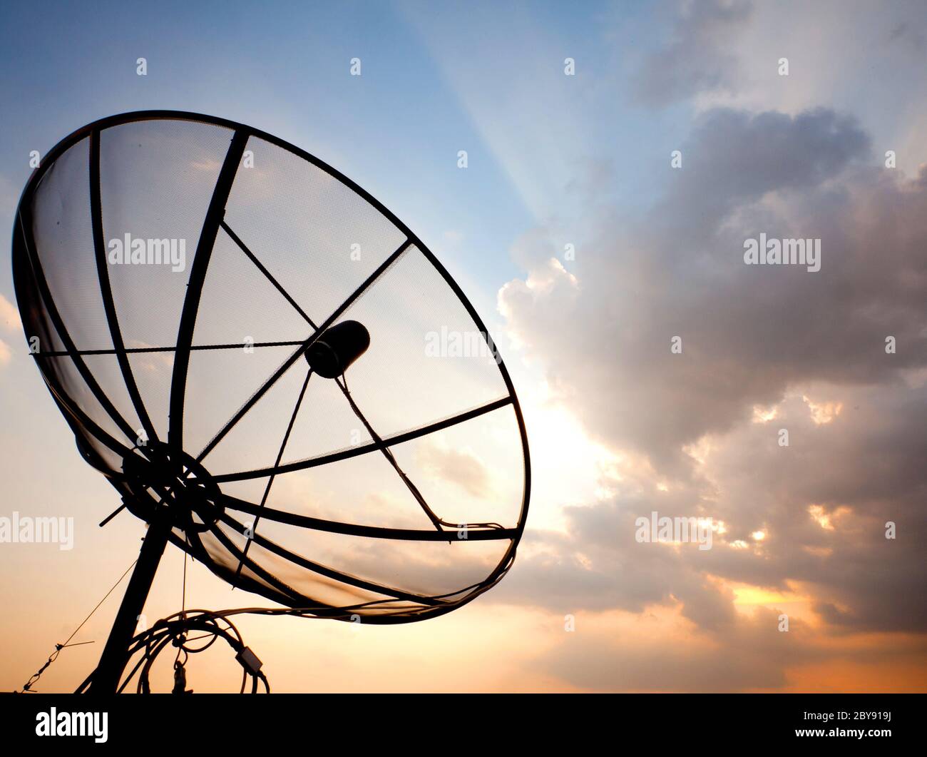 satellite dish over sunset sky Stock Photo - Alamy