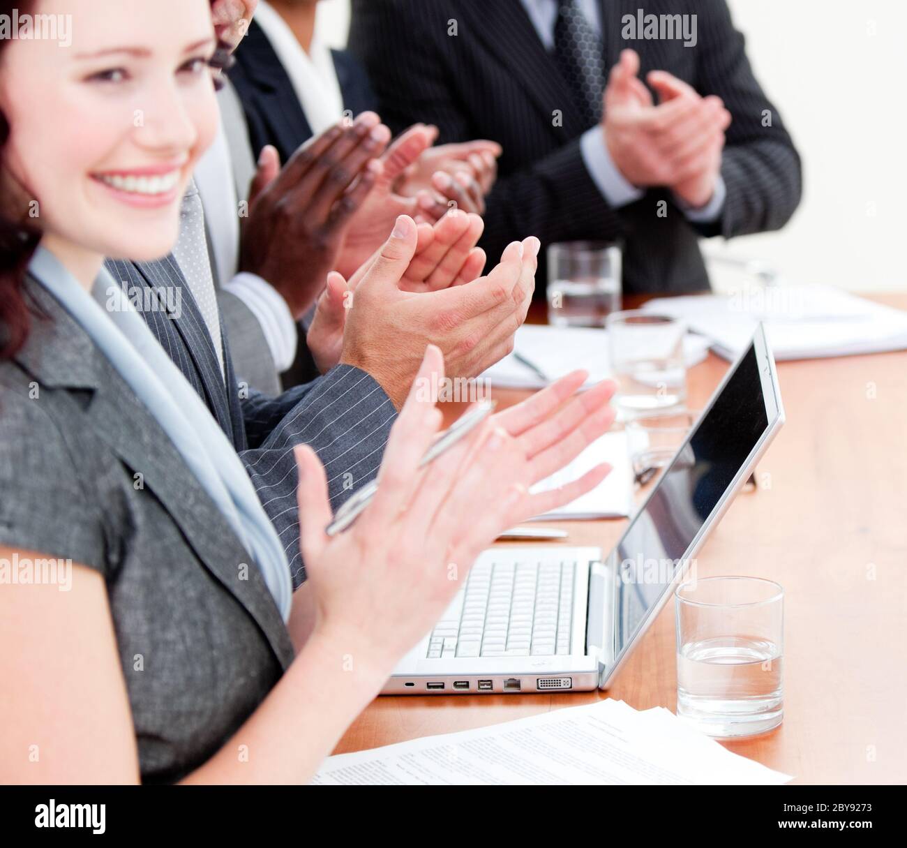 Cheerful business people applauding a good presentation Stock Photo - Alamy