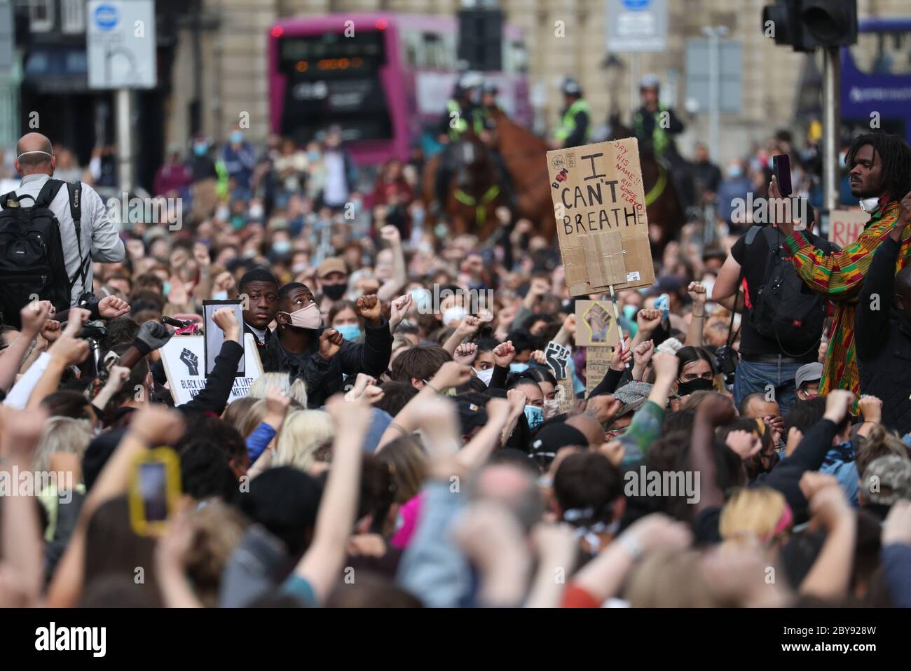 People during a protest calling for the removal of the statue of 19th ...