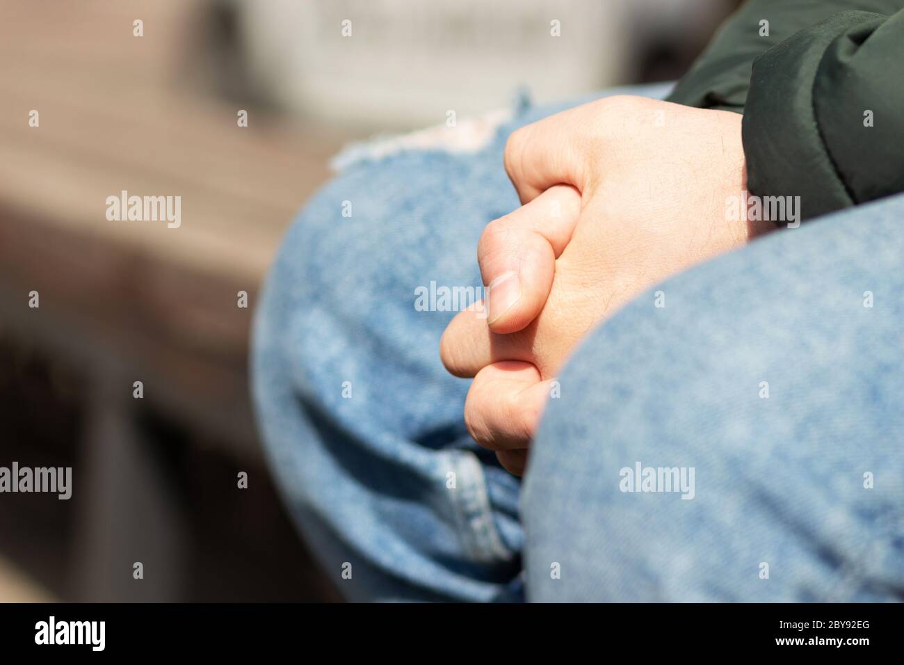 Two interlocked hands hi-res stock photography and images - Alamy