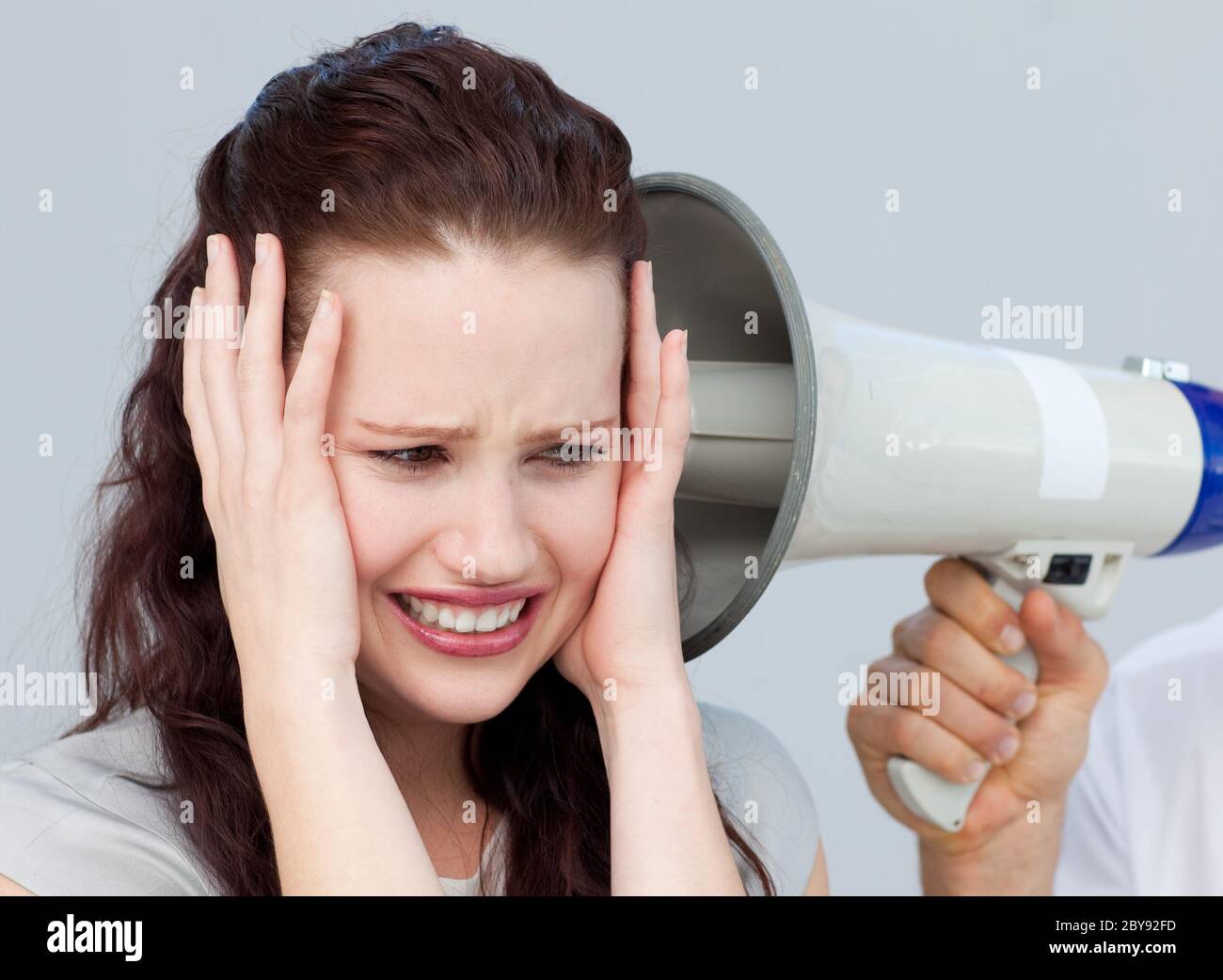 Portrait of a businesswoman getting nervous with a megaphone Stock ...