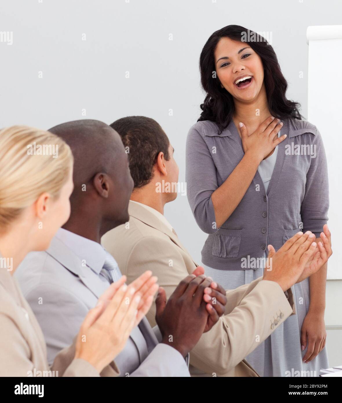Smiling beautiful business woman clapping hi-res stock photography and ...