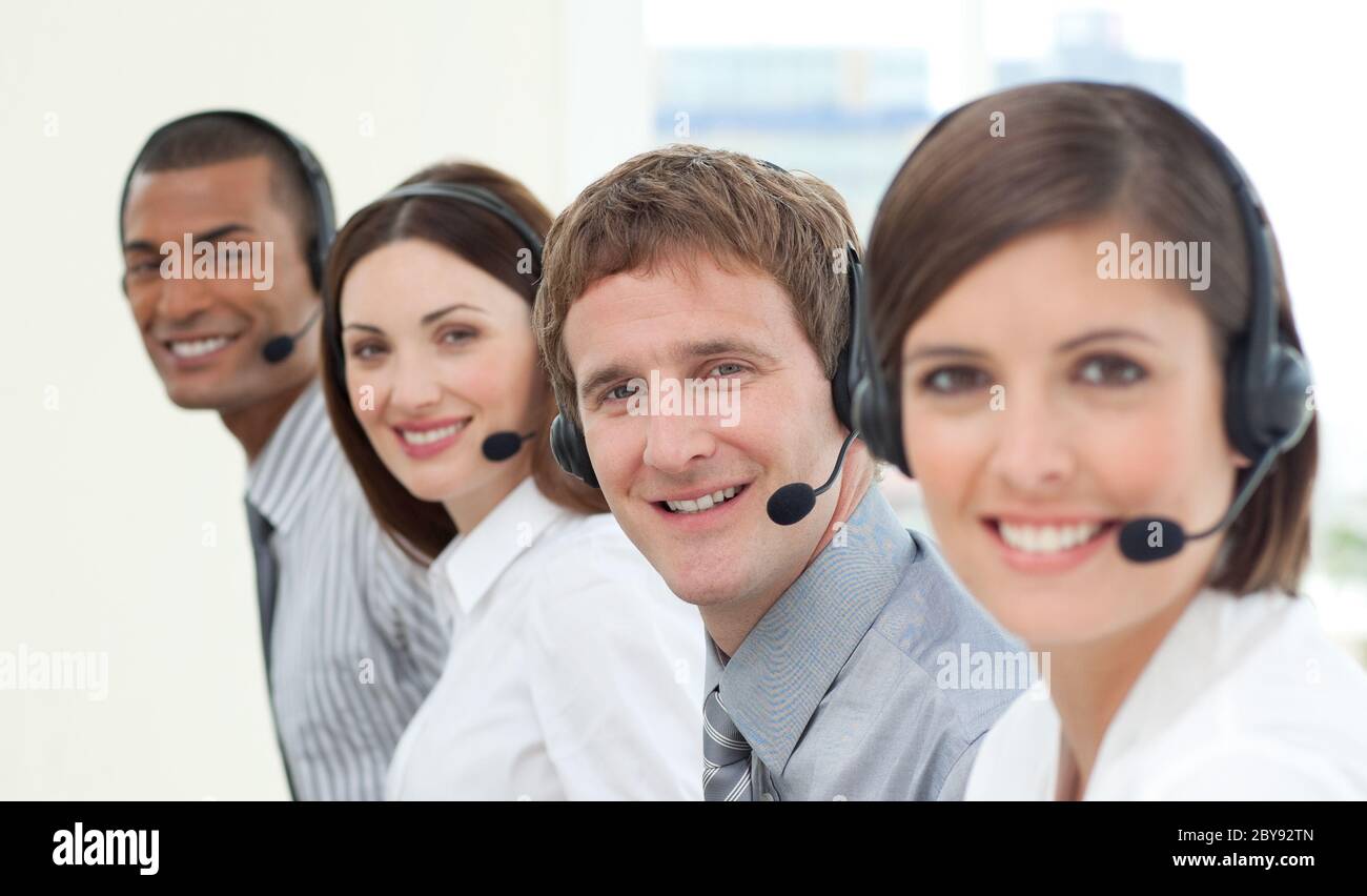Smiling customer service agents with headset on Stock Photo - Alamy