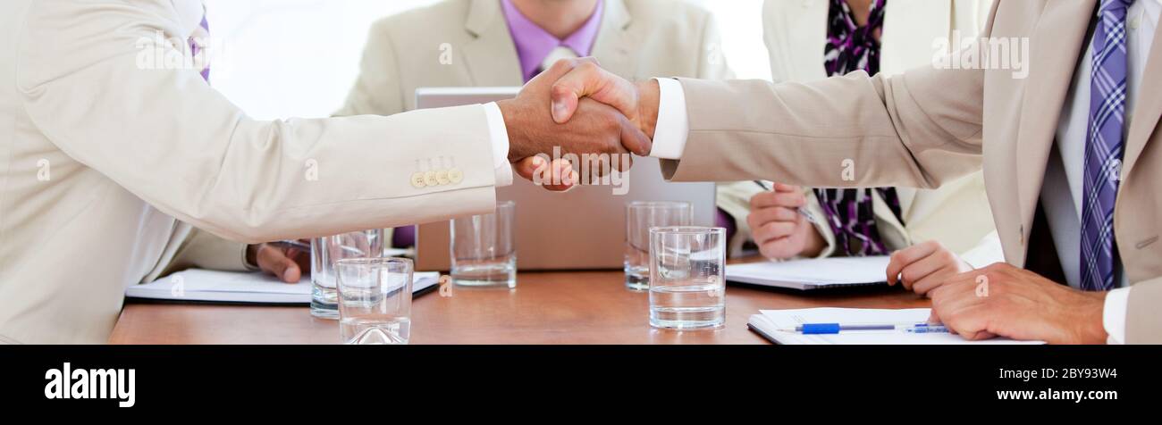Two business people closing a deal Stock Photo - Alamy