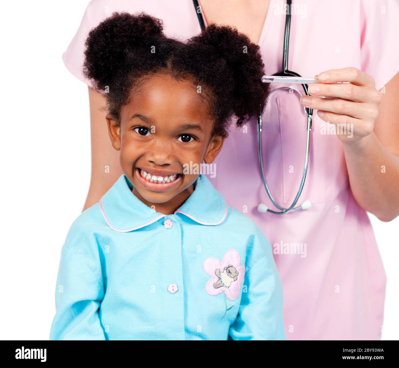 Adorable little girl attending medical check-up isolated on a white ...