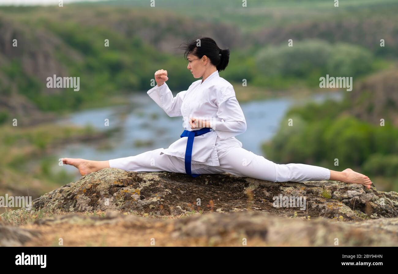 Woman doing karate kick hi-res stock photography and images - Alamy