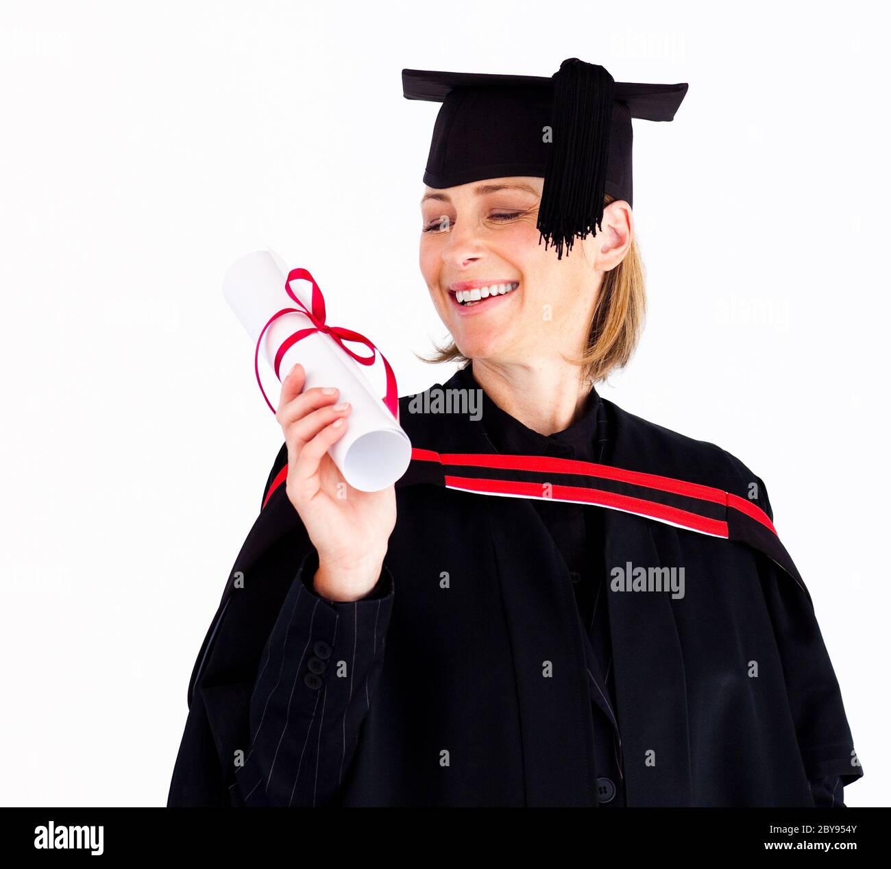 Blonde woman celebrating graduation and showing her diploma Stock Photo ...