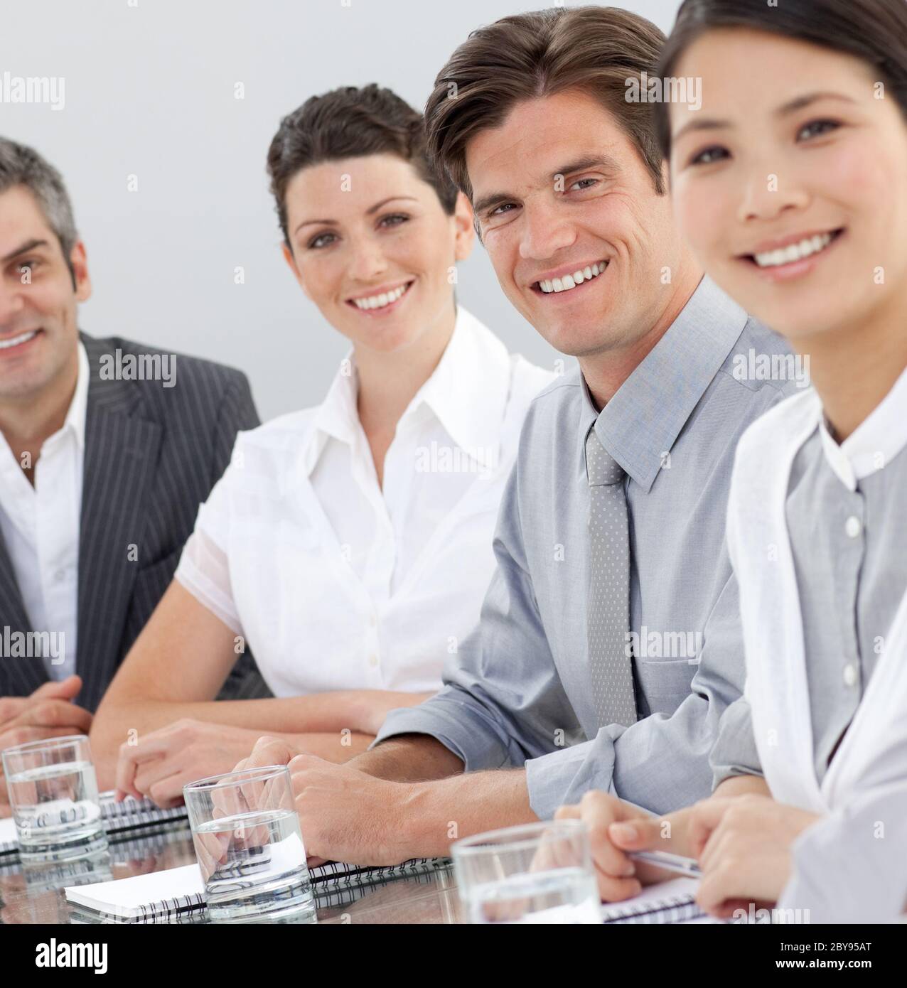 International business people sitting around a conference table Stock ...