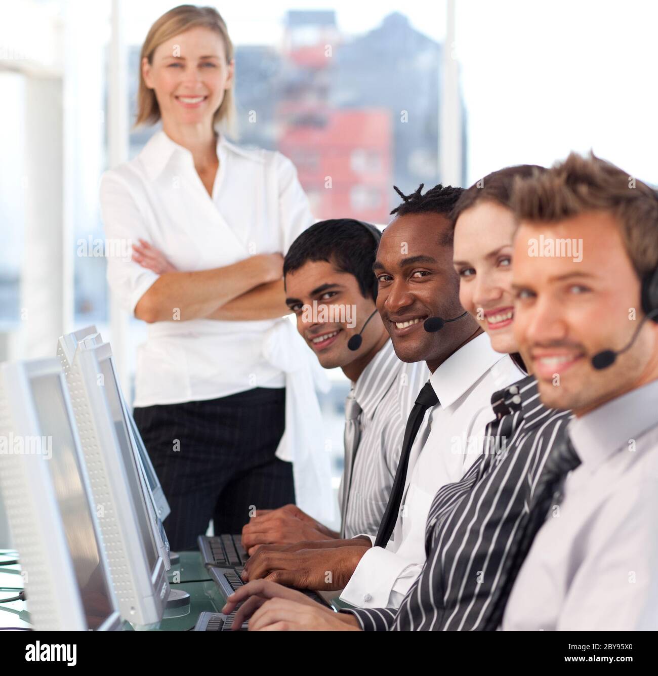 Jolly manager leading her representative team Stock Photo - Alamy