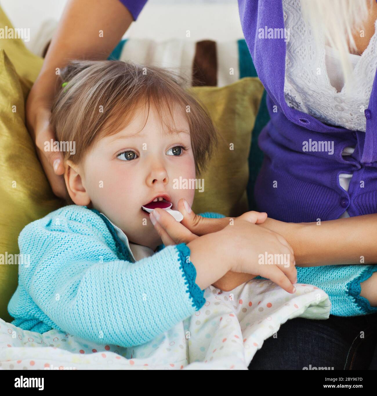 Mother taking care of her pretty child Stock Photo - Alamy