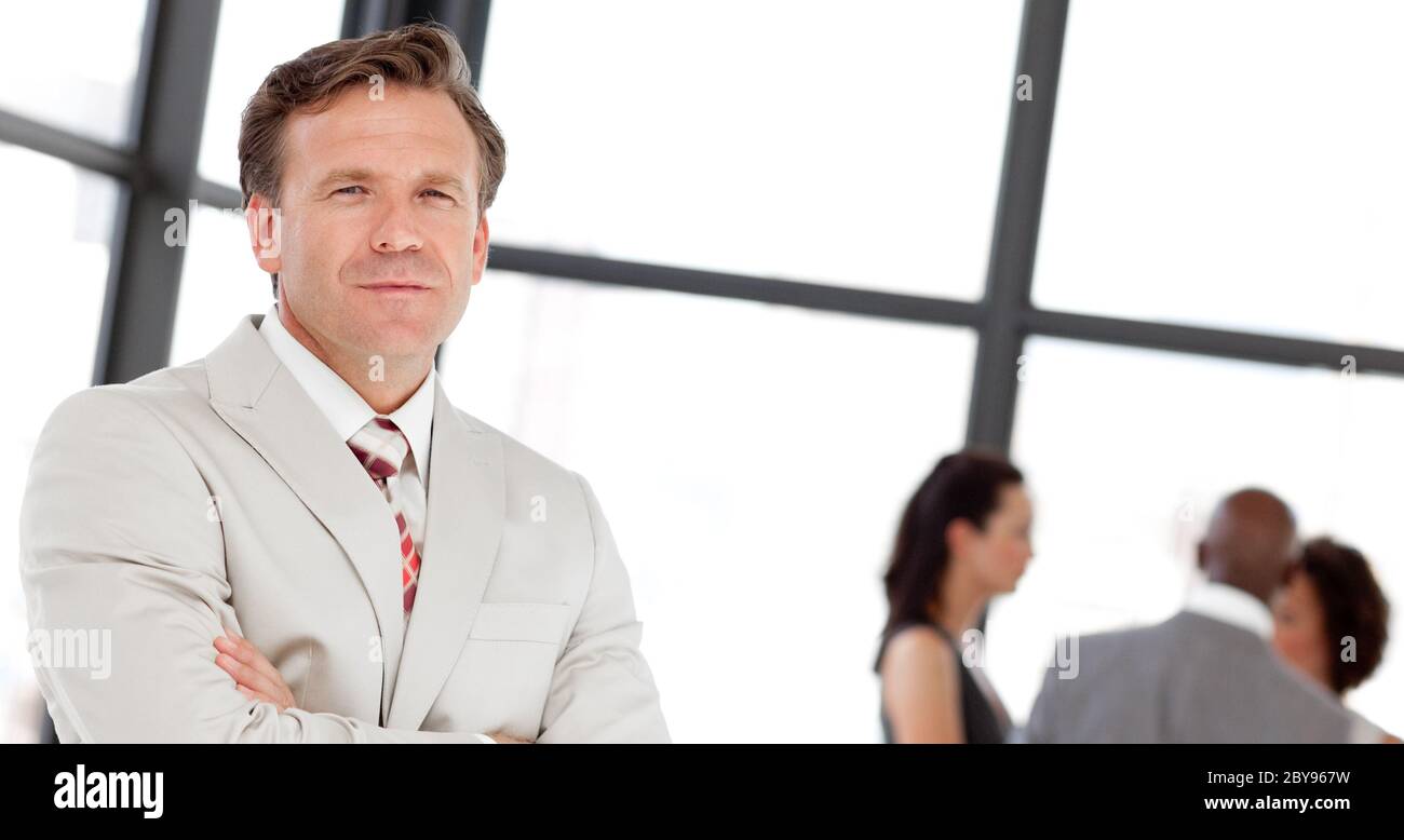 Caucasian male manager leading his team Stock Photo - Alamy
